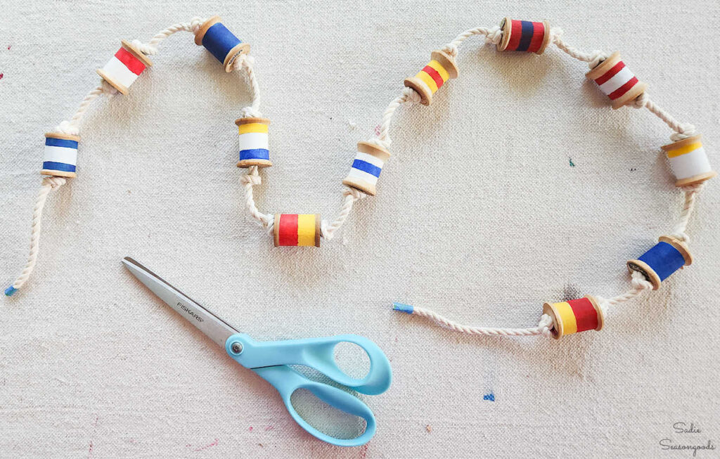 Upcycling Wooden Spools into a Nautical Style Summer Garland
